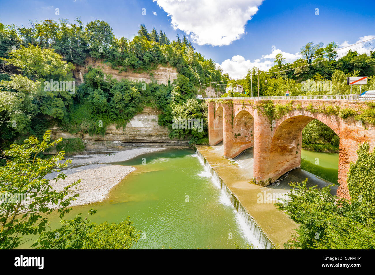 fourteenth century bridge in masonry over the River in a small village ...