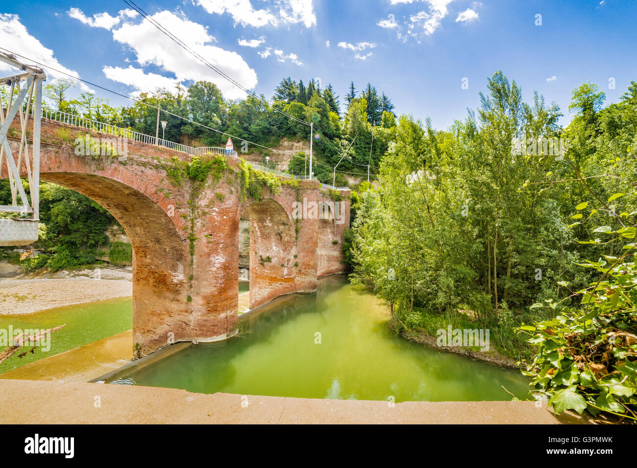 fourteenth century bridge in masonry over the River in a small village ...
