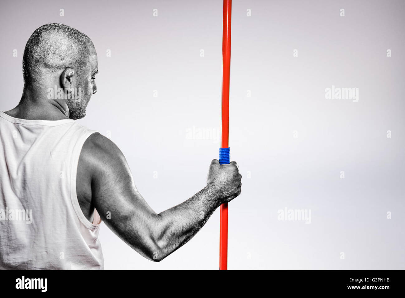 Composite image of rear view of athlete standing with javelin Stock ...