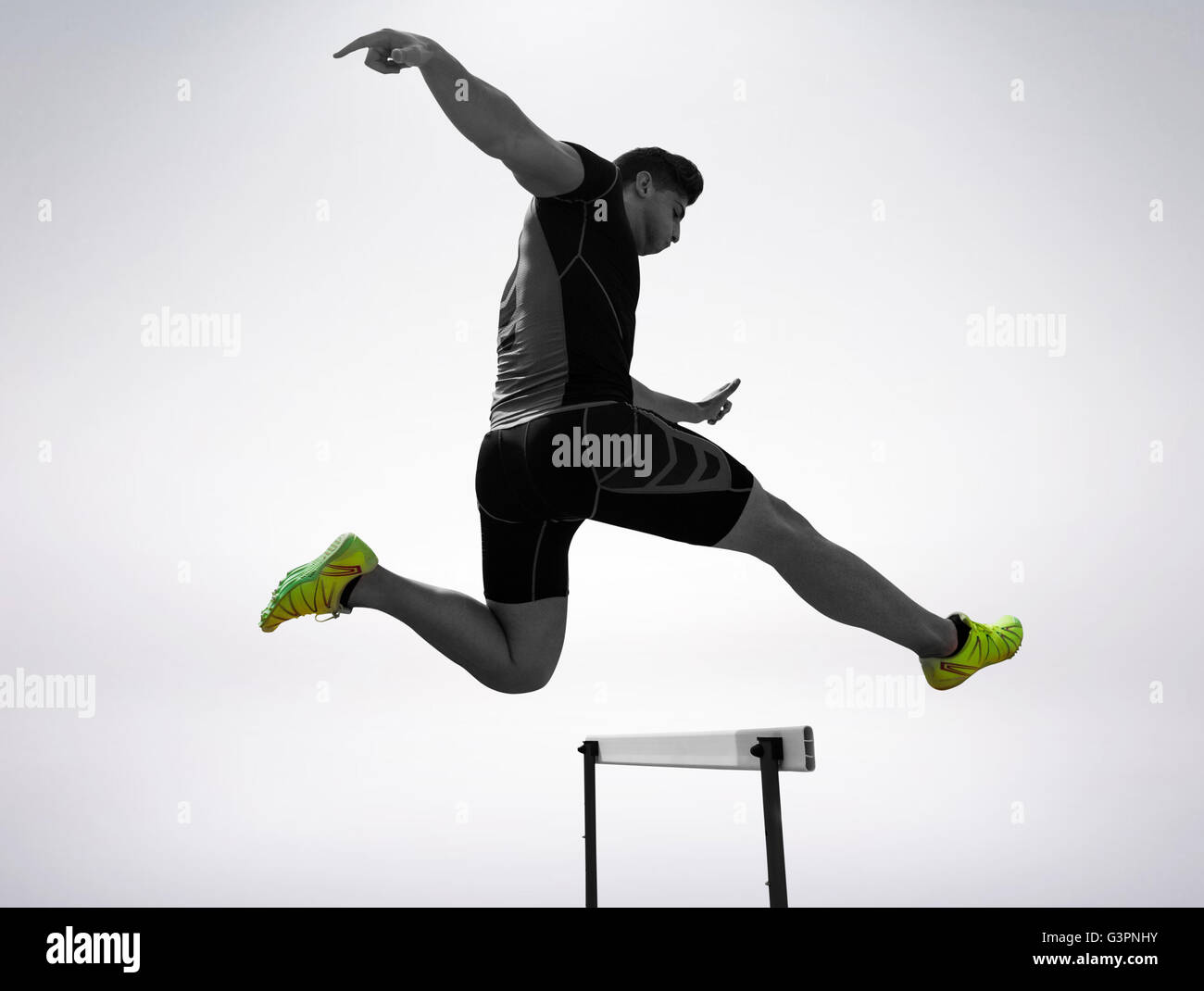 Athletic woman practicing show jumping Stock Photo - Alamy