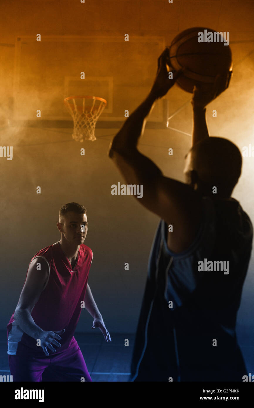 Portrait of two men playing basketball Stock Photo - Alamy