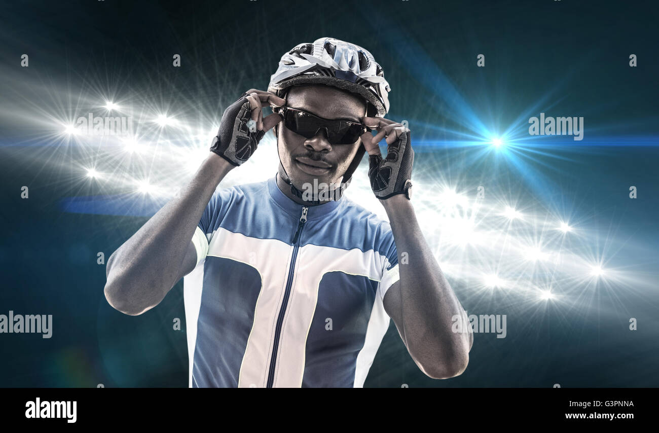 Composite image of cyclist is posing Stock Photo - Alamy