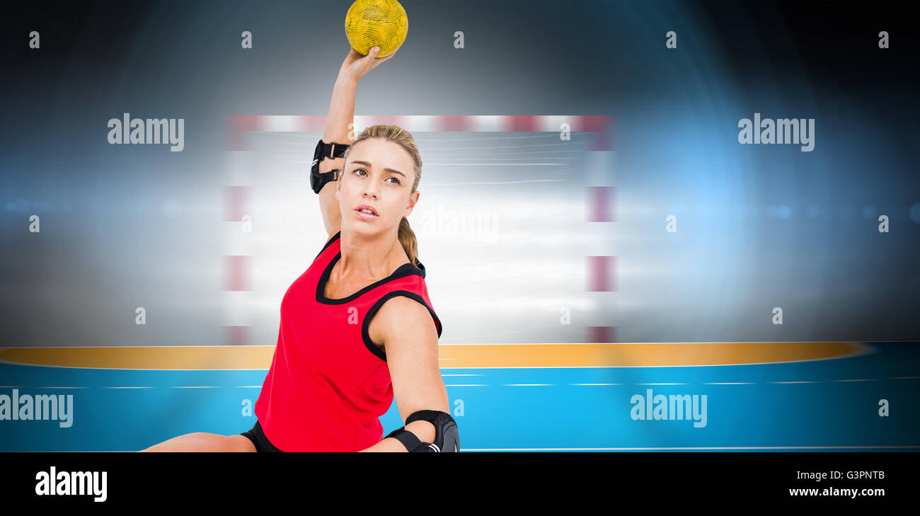 Composite image of female athlete throwing handball Stock Photo - Alamy