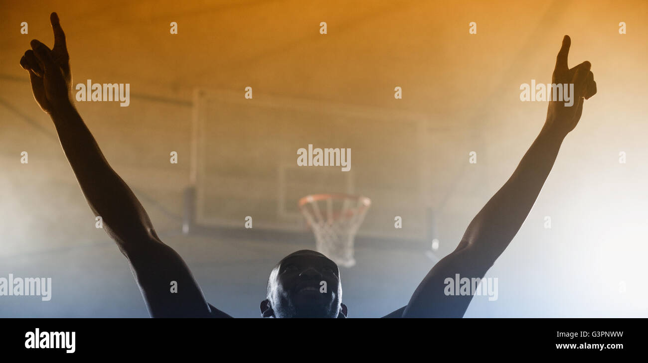 Rear view of a basketball player with his arms in the air Stock Photo ...