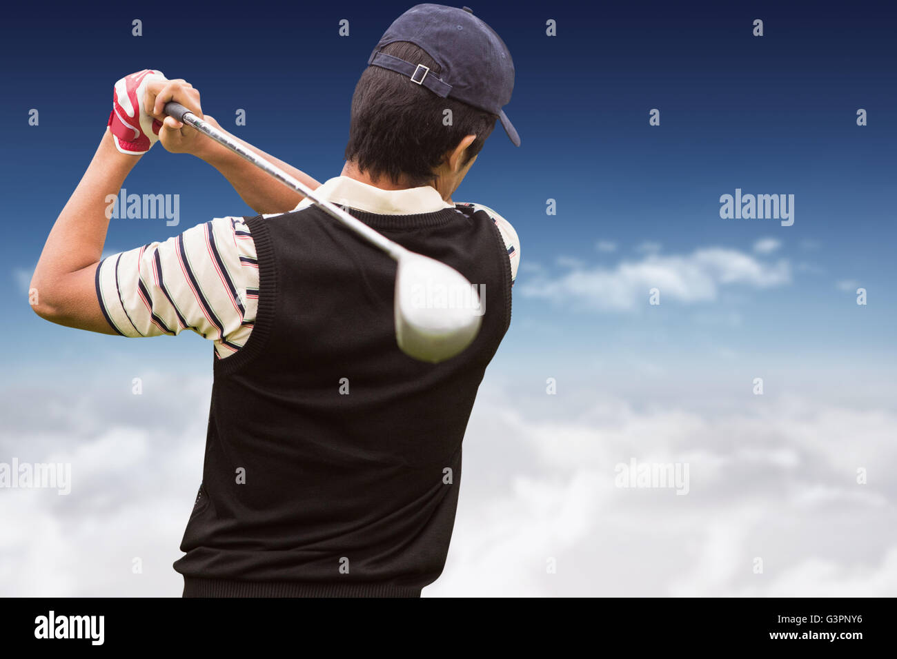 Rear view of man playing golf Stock Photo - Alamy