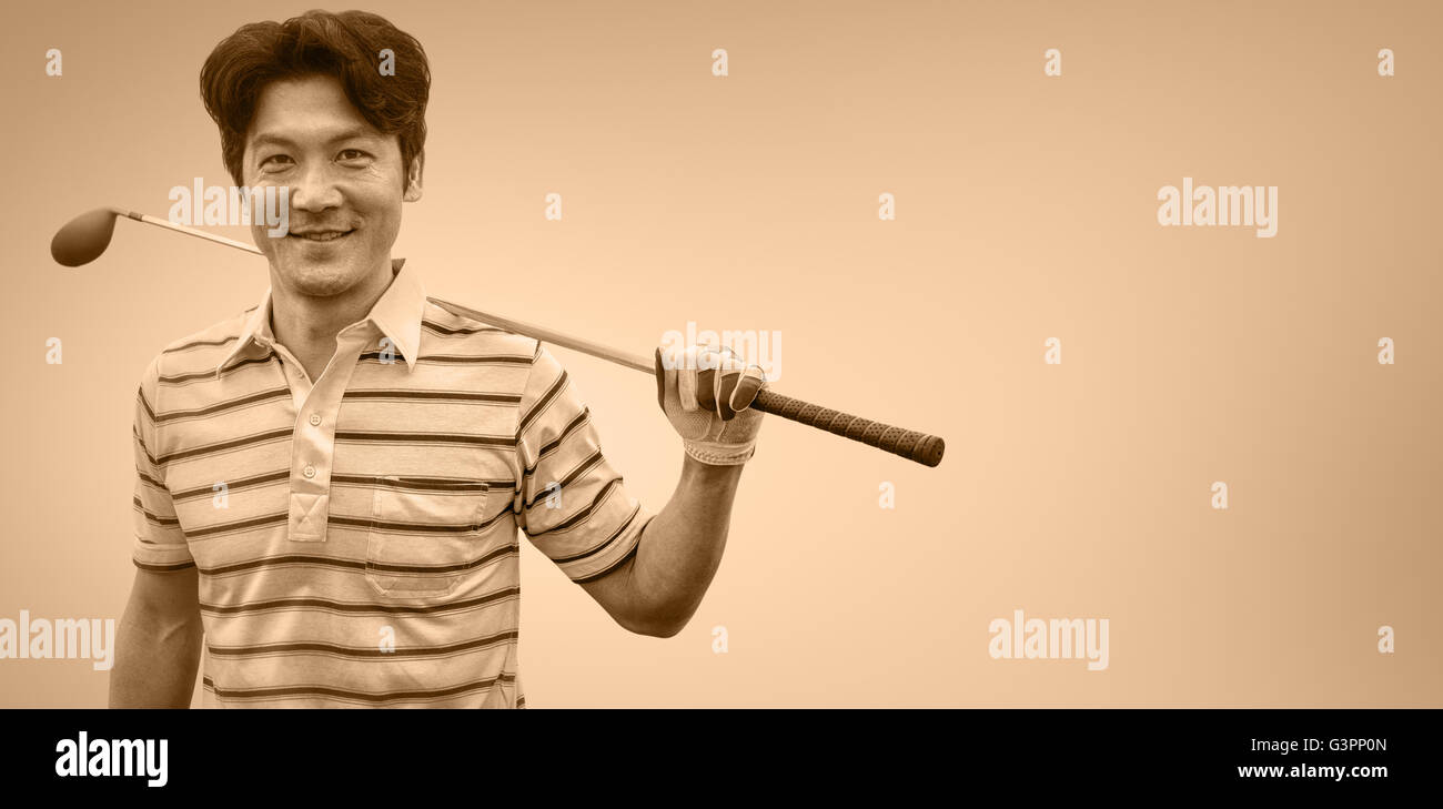 Composite image of man with golf club Stock Photo - Alamy