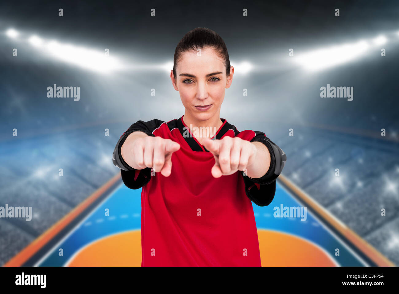 Composite image of female athlete posing with elbow pad and pointing ...