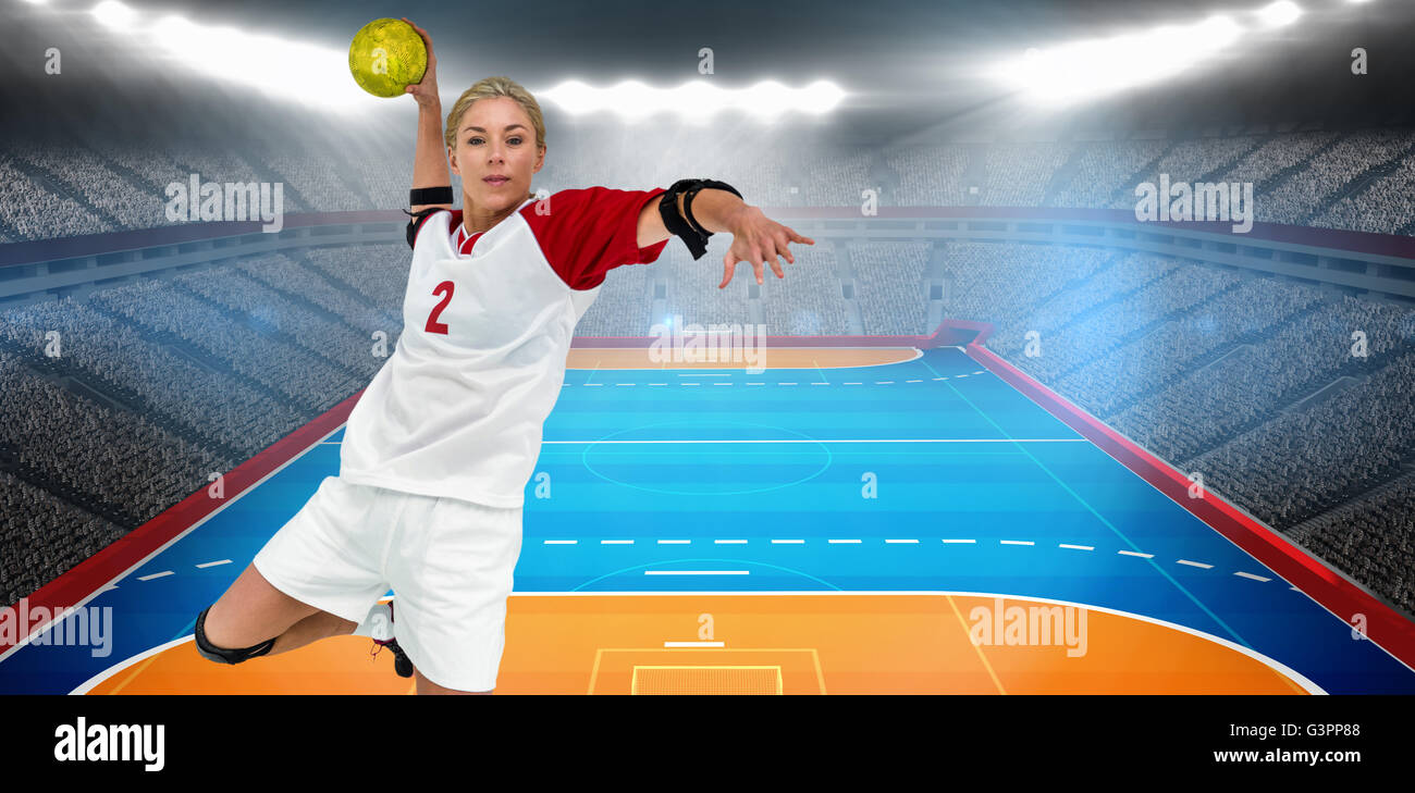 Sportswoman throwing a ball Stock Photo - Alamy