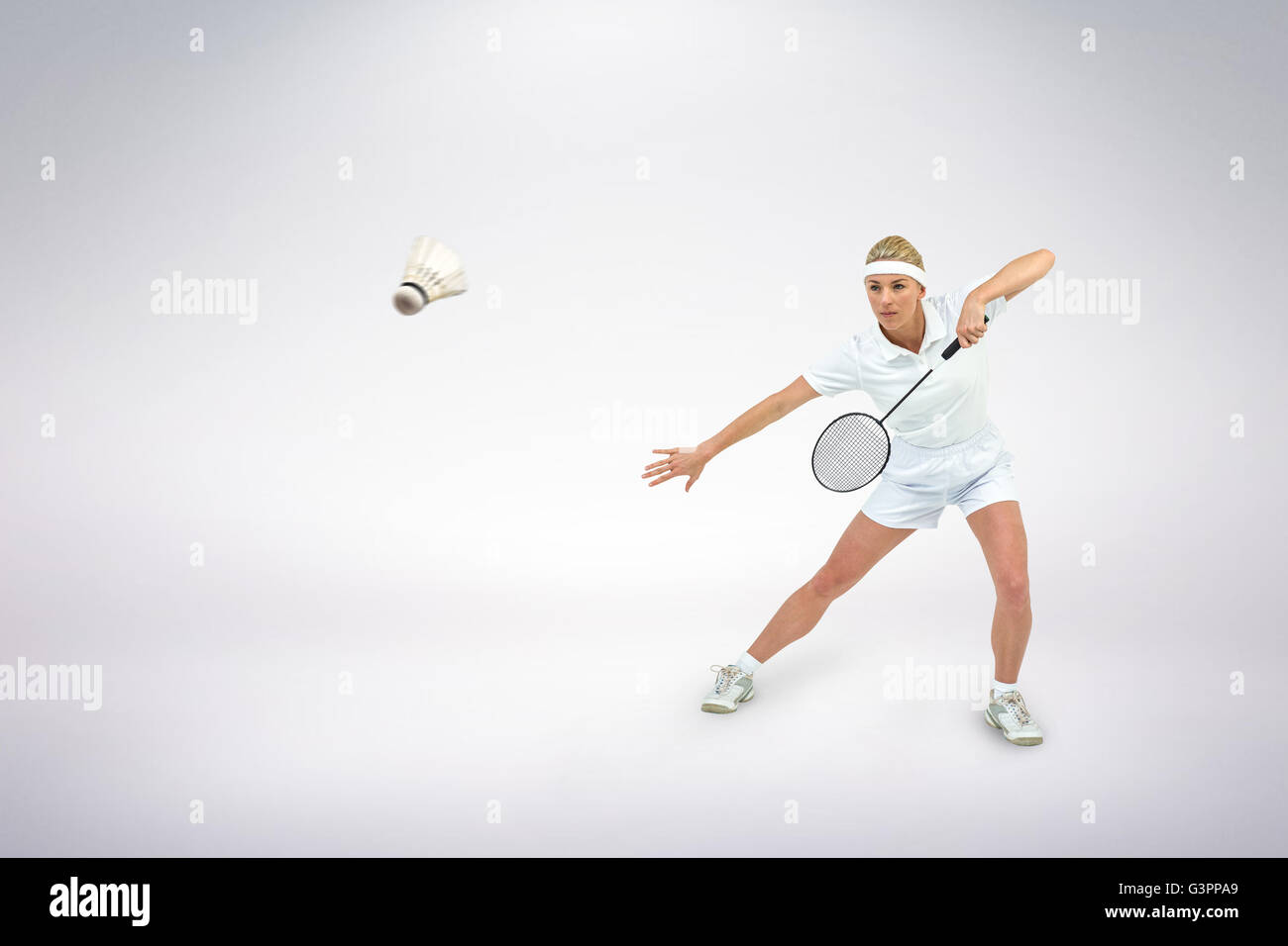 Composite image of badminton player playing badminton Stock Photo - Alamy