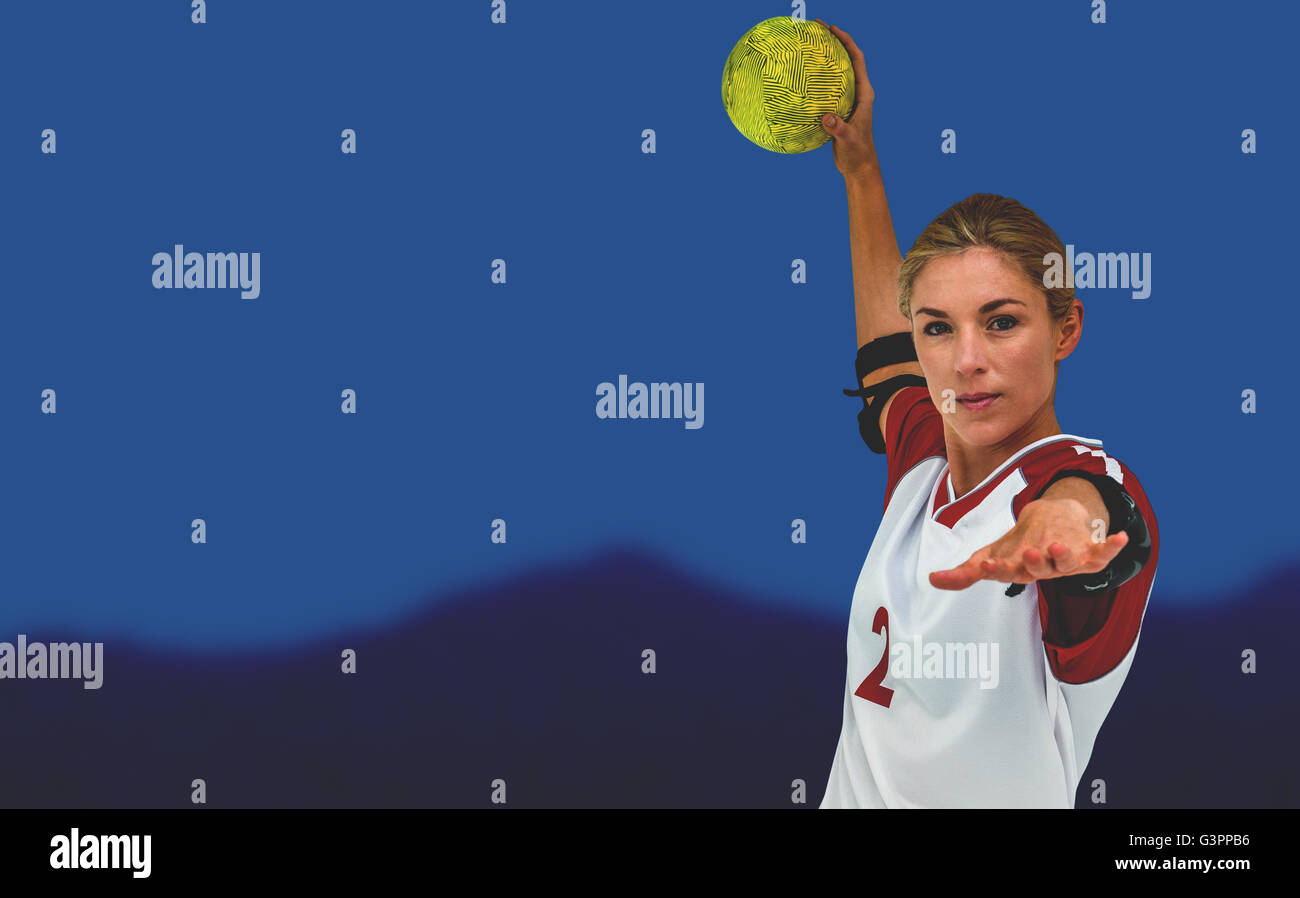 Sportswoman throwing a ball Stock Photo - Alamy