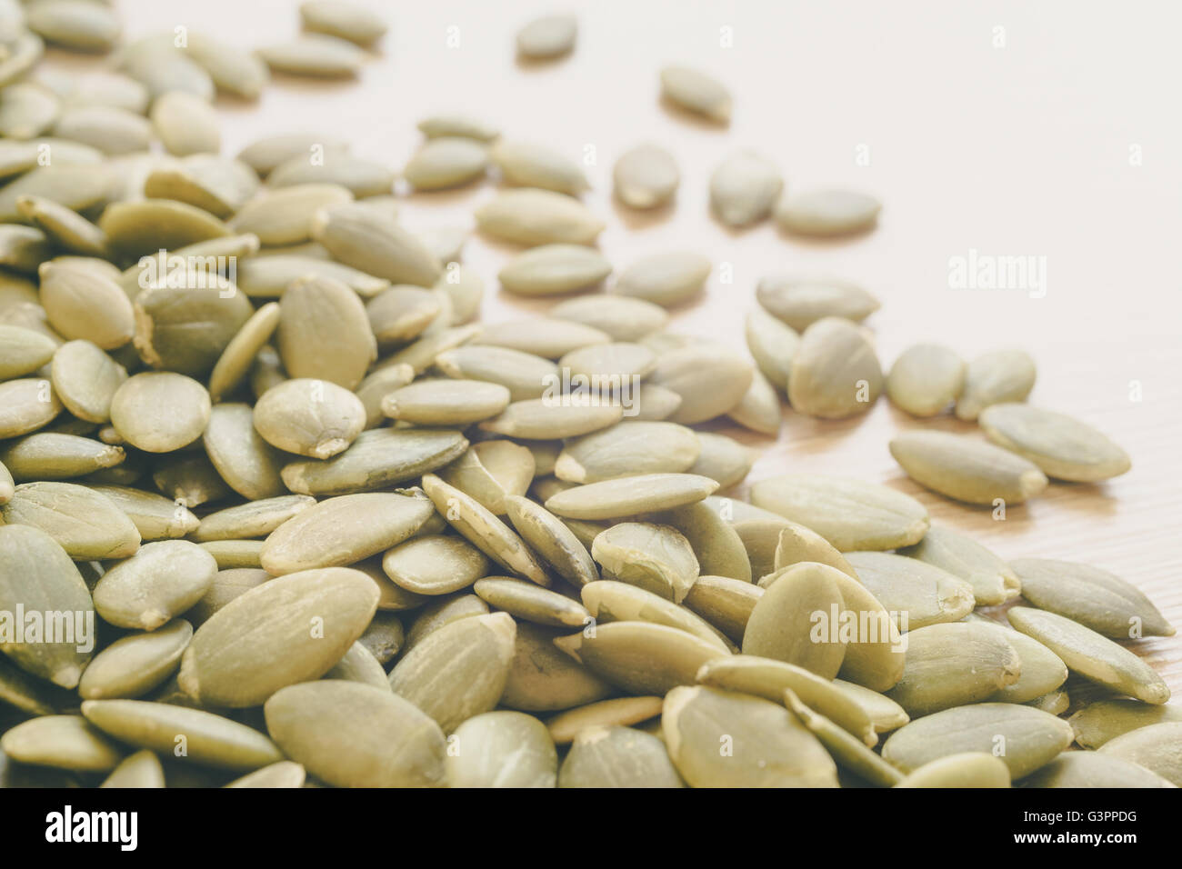 Shelled pumpkin seeds on green hi-res stock photography and images - Alamy