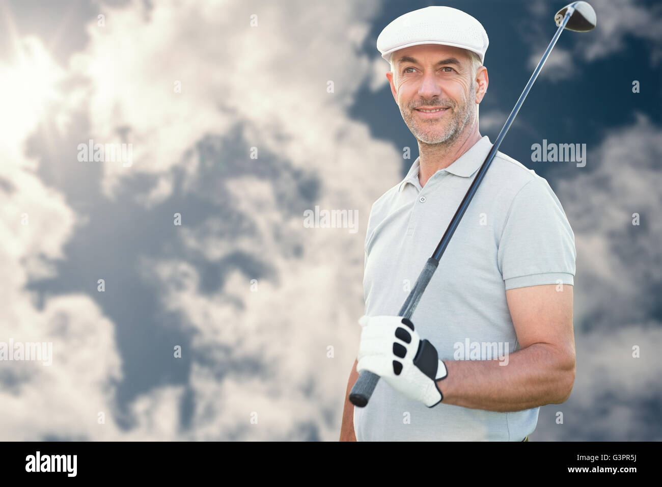 Man holding a golf club Stock Photo - Alamy