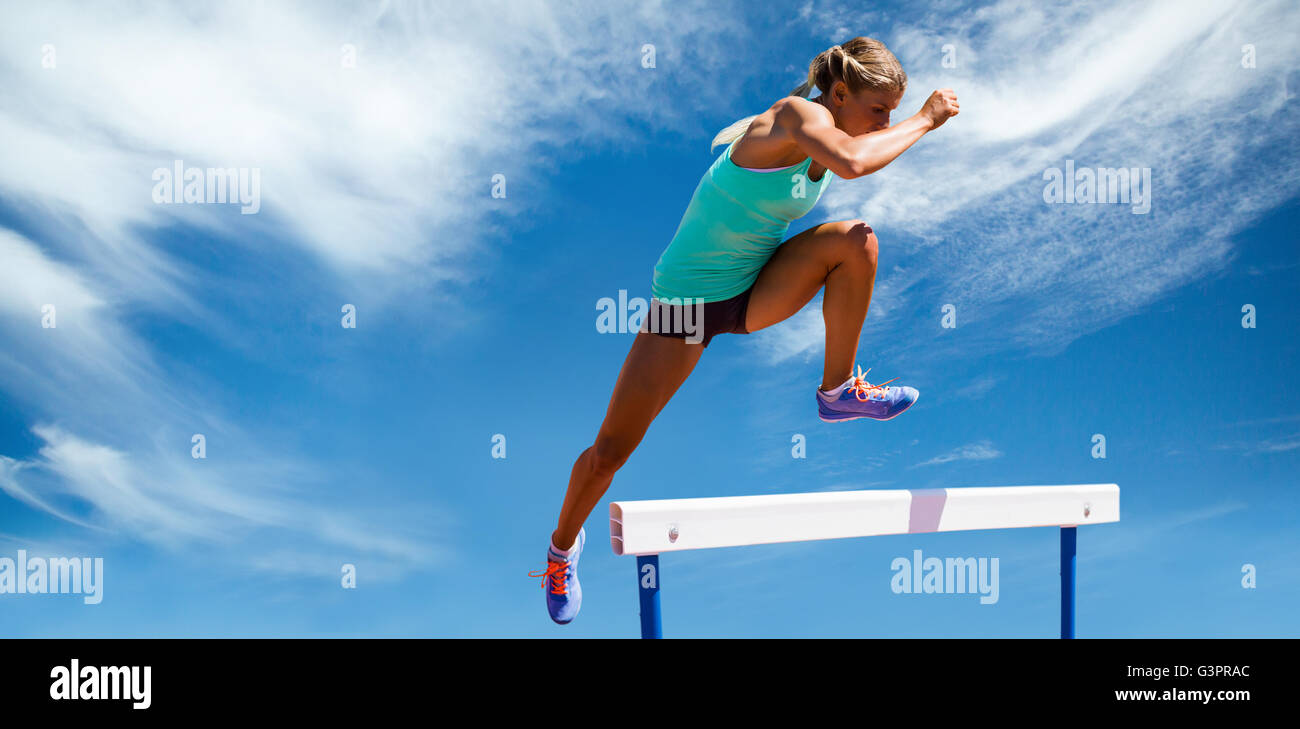 Runner jumping a hurdle hi-res stock photography and images - Alamy