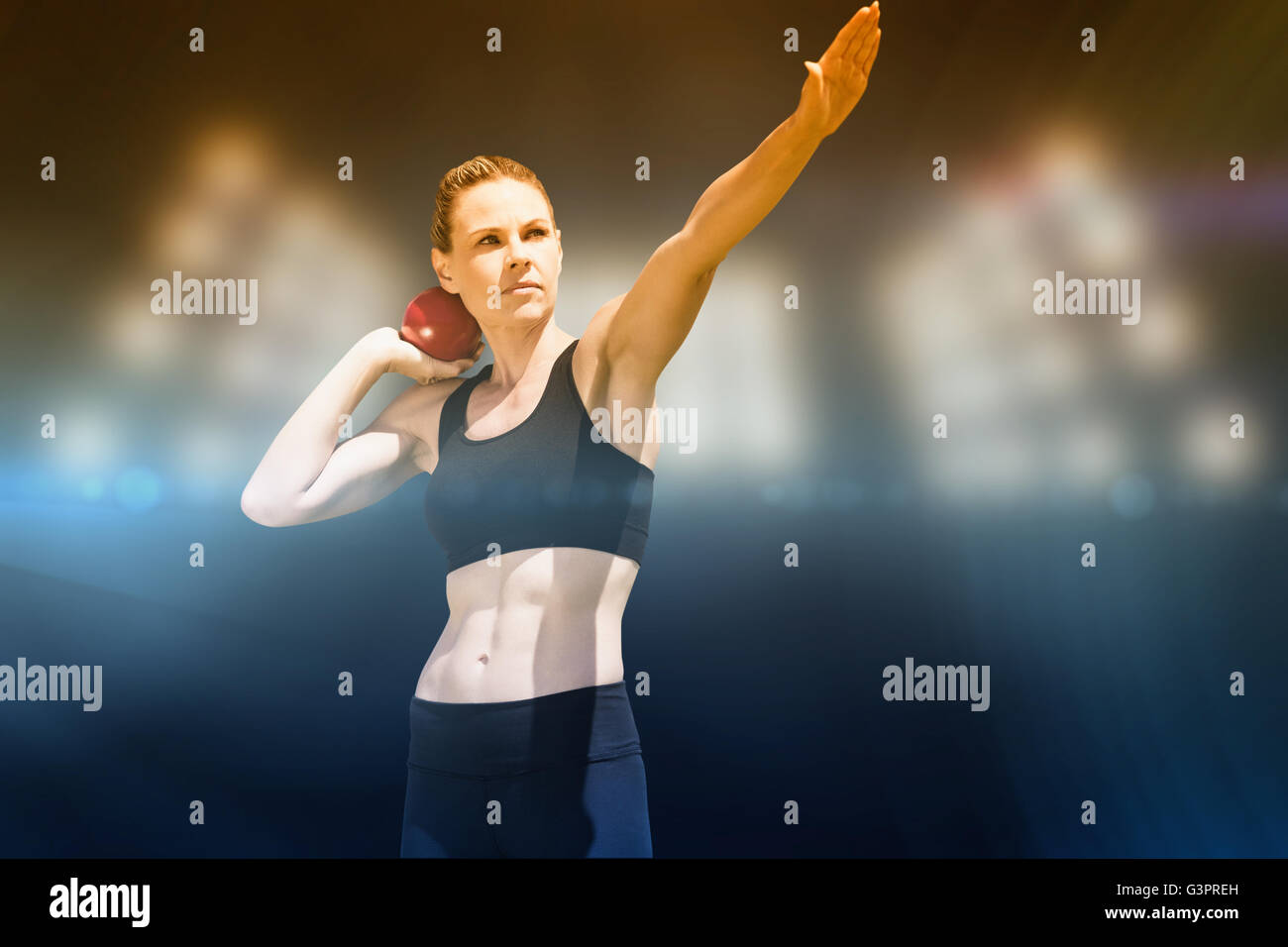Composite image of sportswoman practising the shot put Stock Photo - Alamy