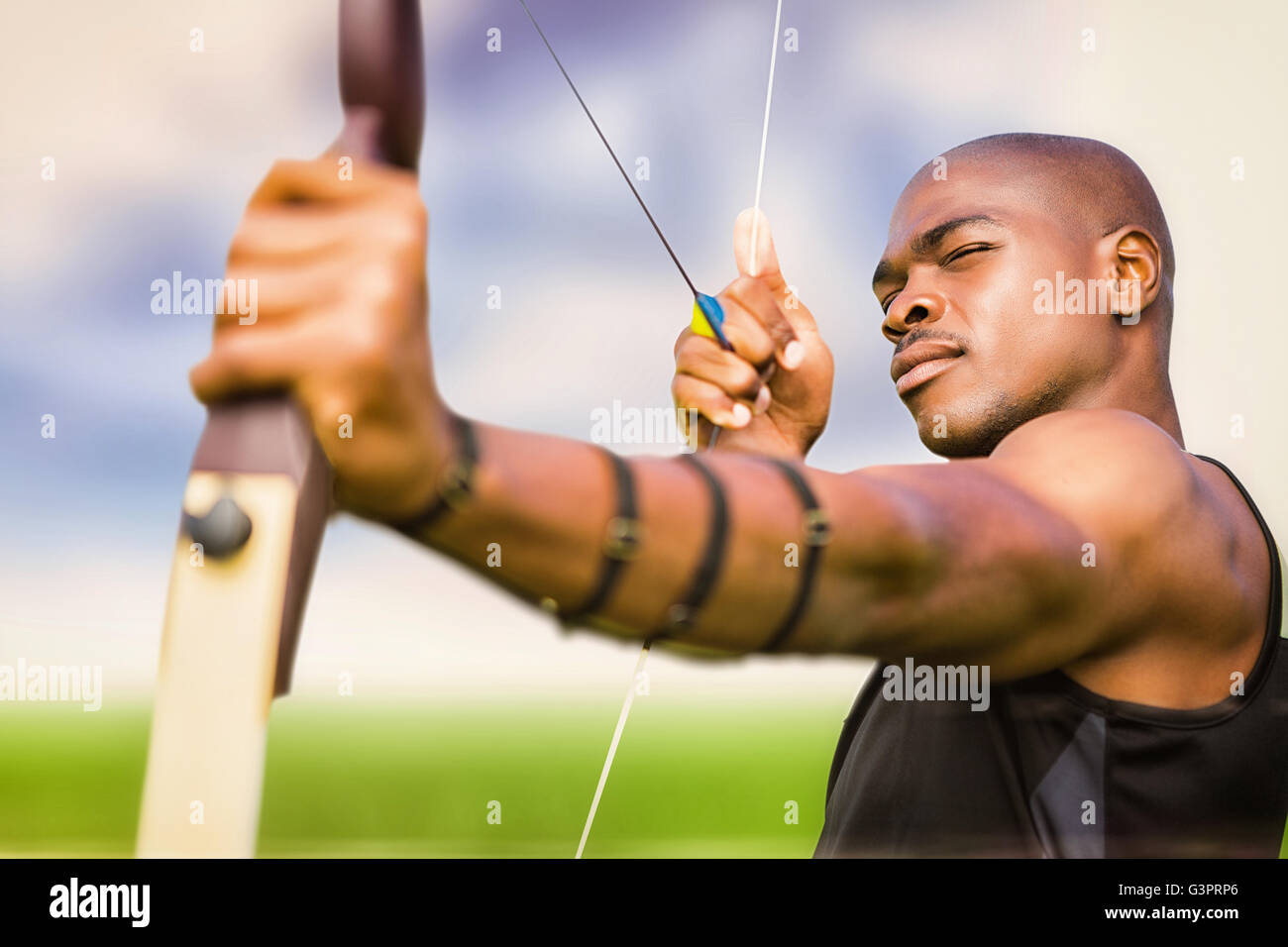 Composite image of front view of sportsman practising archery Stock ...