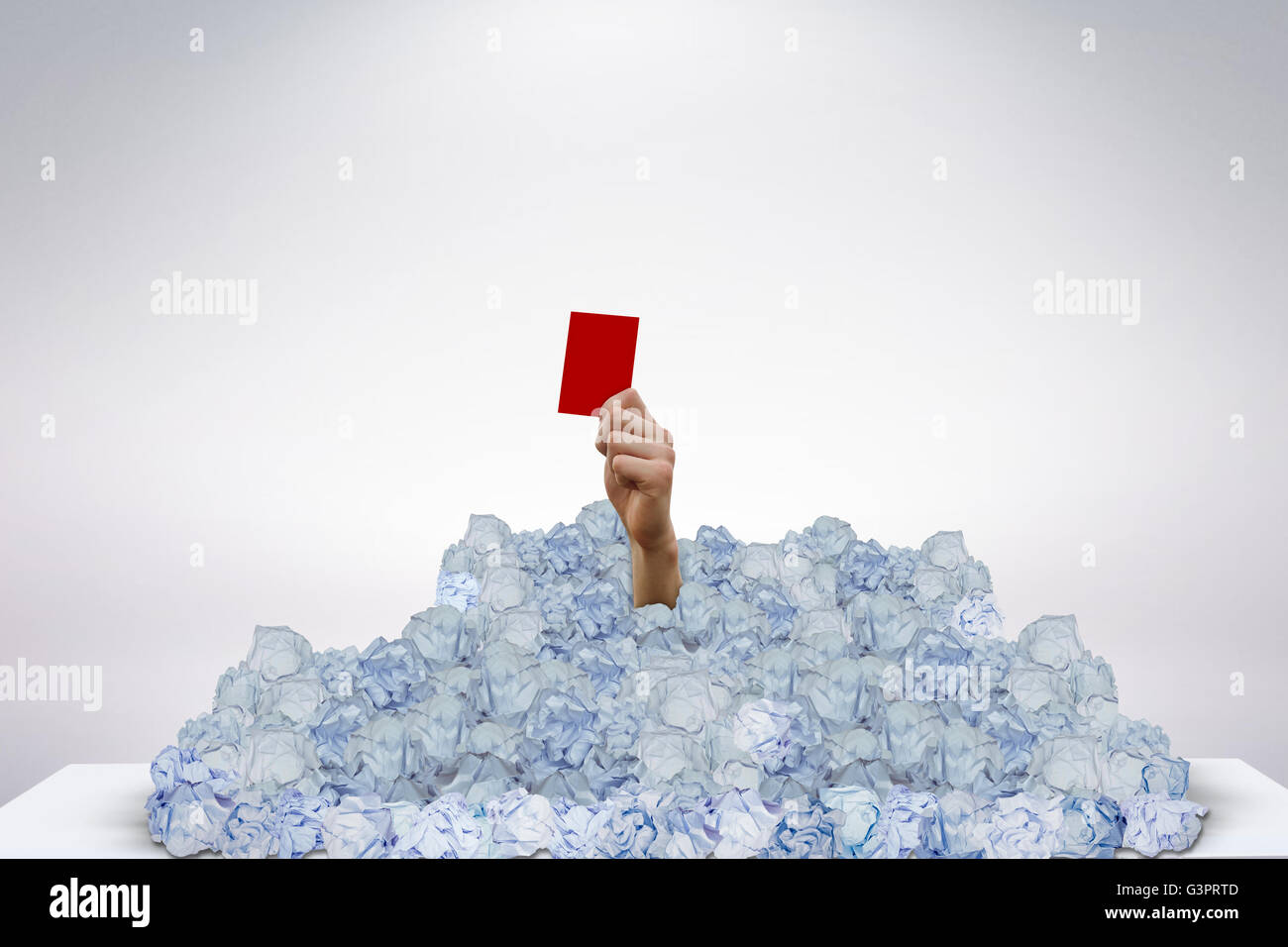Composite image of hand holding up red card Stock Photo - Alamy