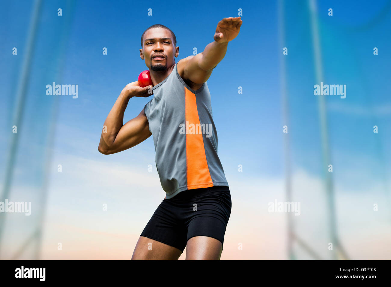 Composite image of front view of sportsman practising shot put Stock ...