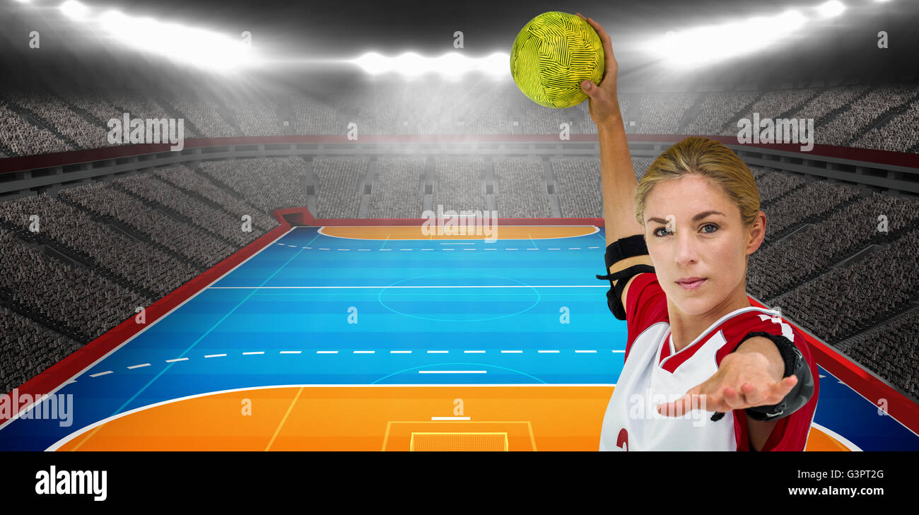 Sportswoman throwing a ball Stock Photo - Alamy