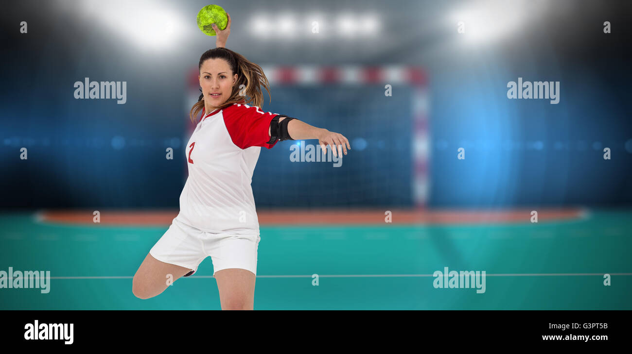 Sportswoman throwing a ball Stock Photo - Alamy