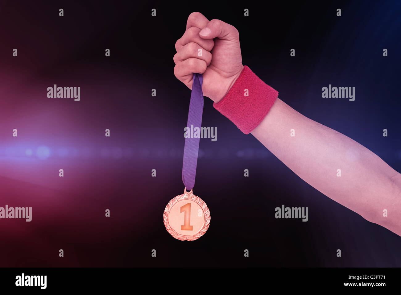 Athlete holding gold medal after victory Stock Photo - Alamy