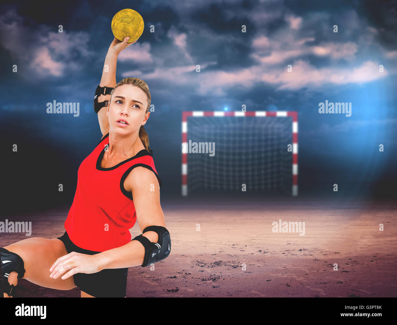 Female athlete throwing handball Stock Photo - Alamy