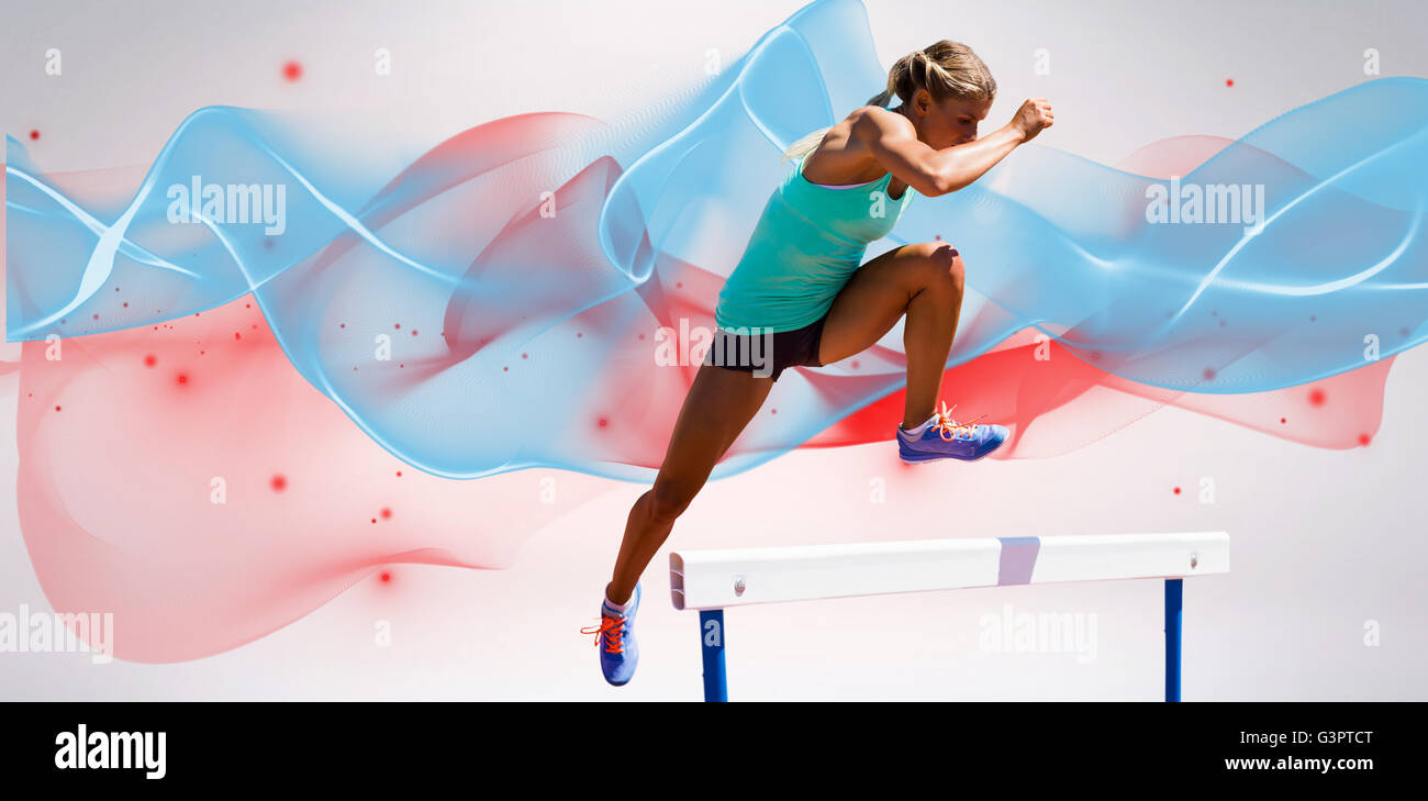 Composite image of athlete woman jumping a hurdle Stock Photo - Alamy