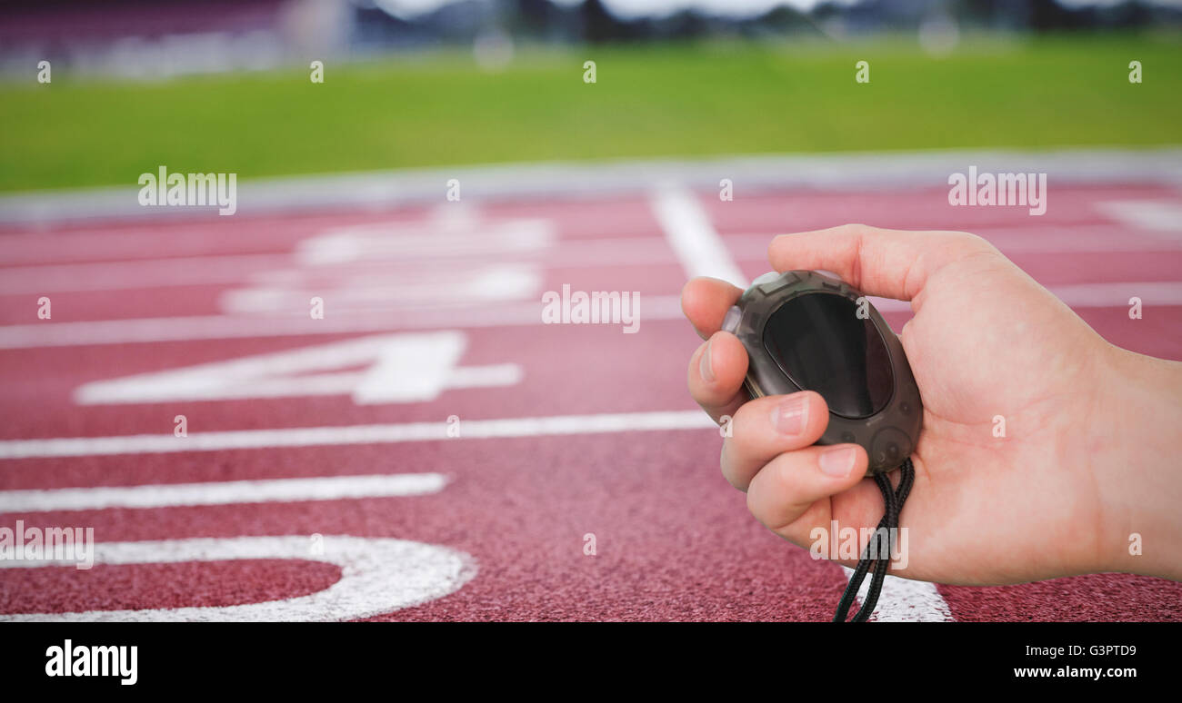 Close up of coach is holding a stopwatch Stock Photo - Alamy