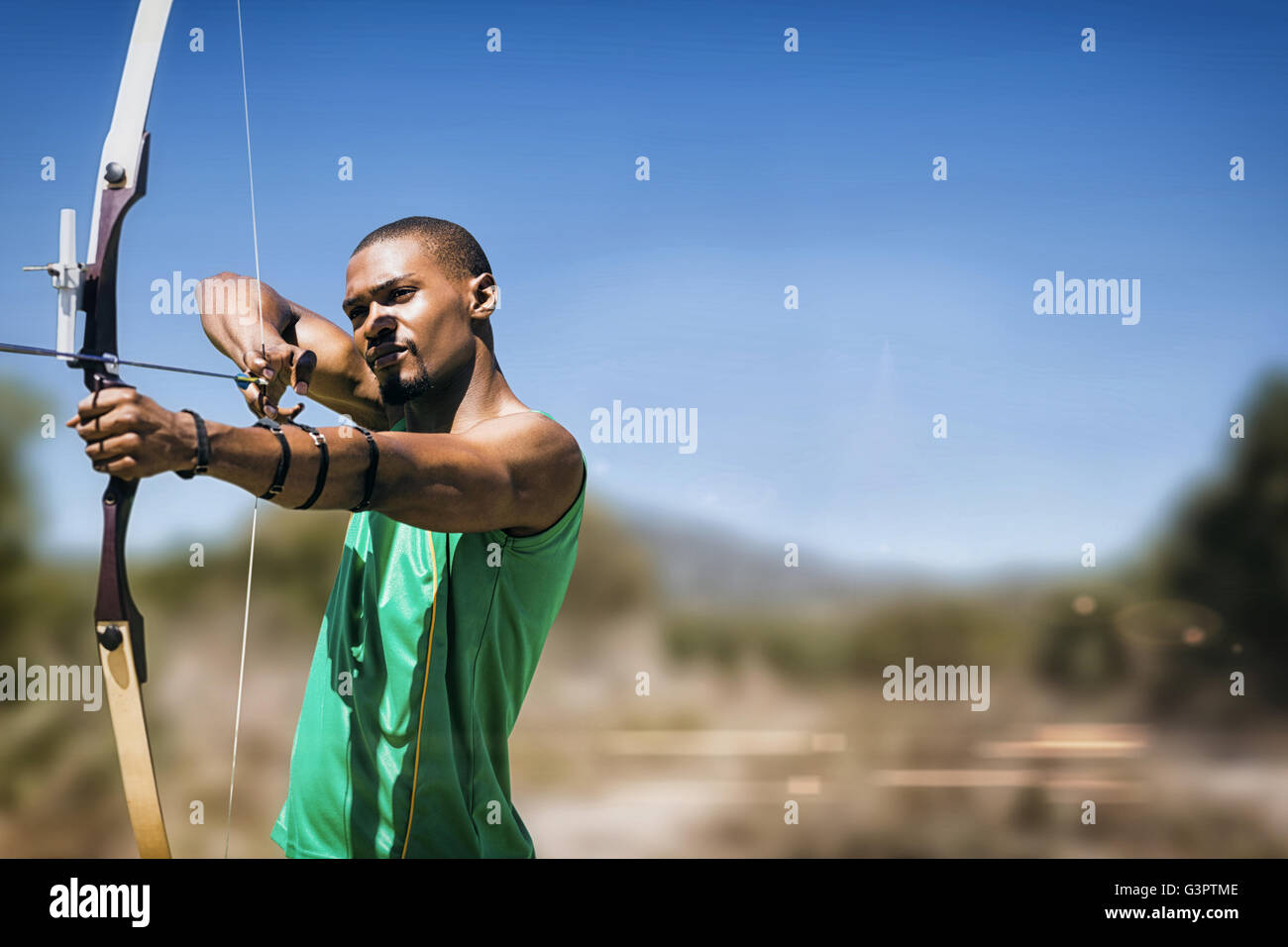 Composite image of facing view of man practicing archery against white ...