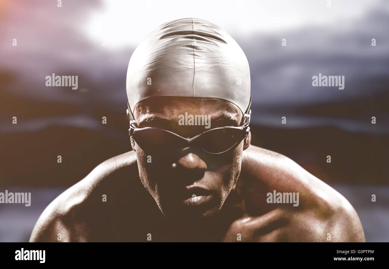 Composite image of swimmer ready to dive Stock Photo - Alamy