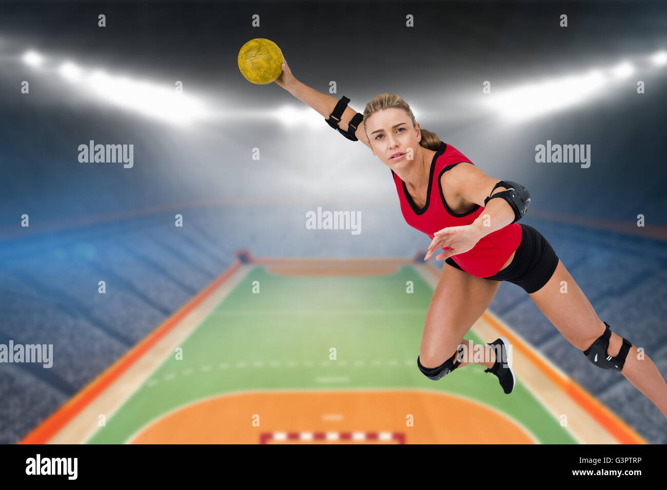Female athlete throwing handball Stock Photo - Alamy