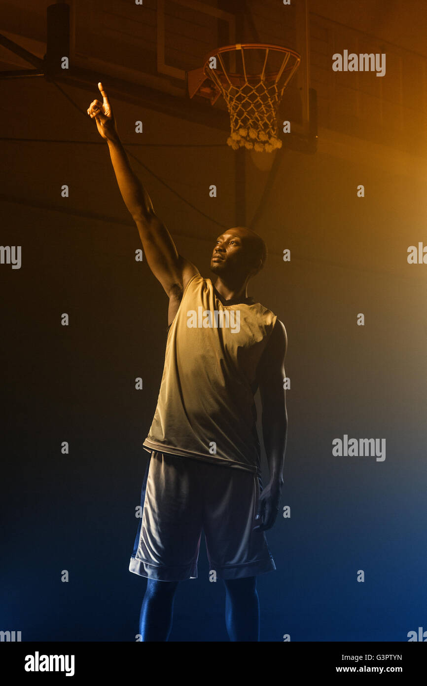 Basketball player pointing up with his finger Stock Photo - Alamy