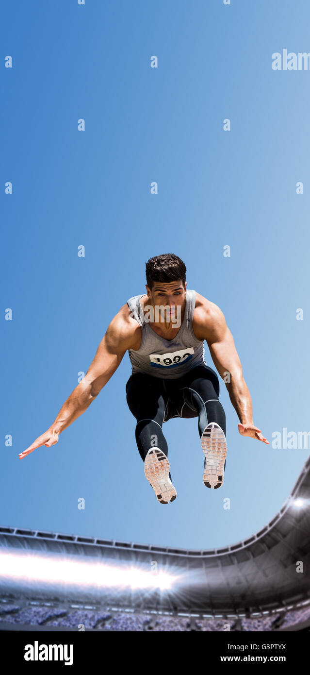 Front view of sportsman is jumping Stock Photo - Alamy