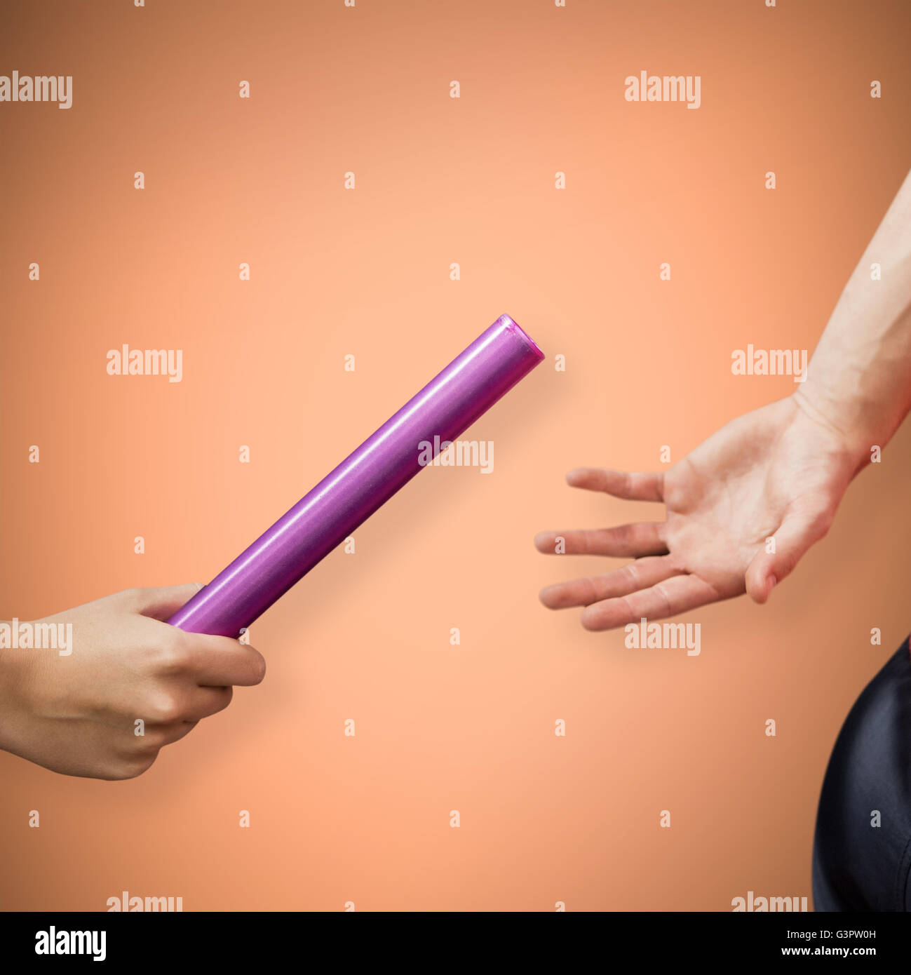 Athlete passing a baton to the partner Stock Photo - Alamy