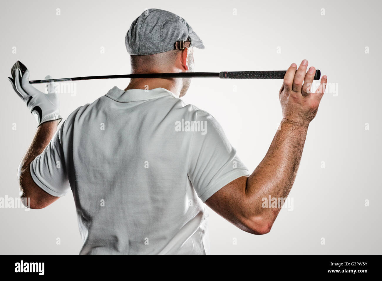 Composite image of rear view of golf player holding a golf club Stock ...