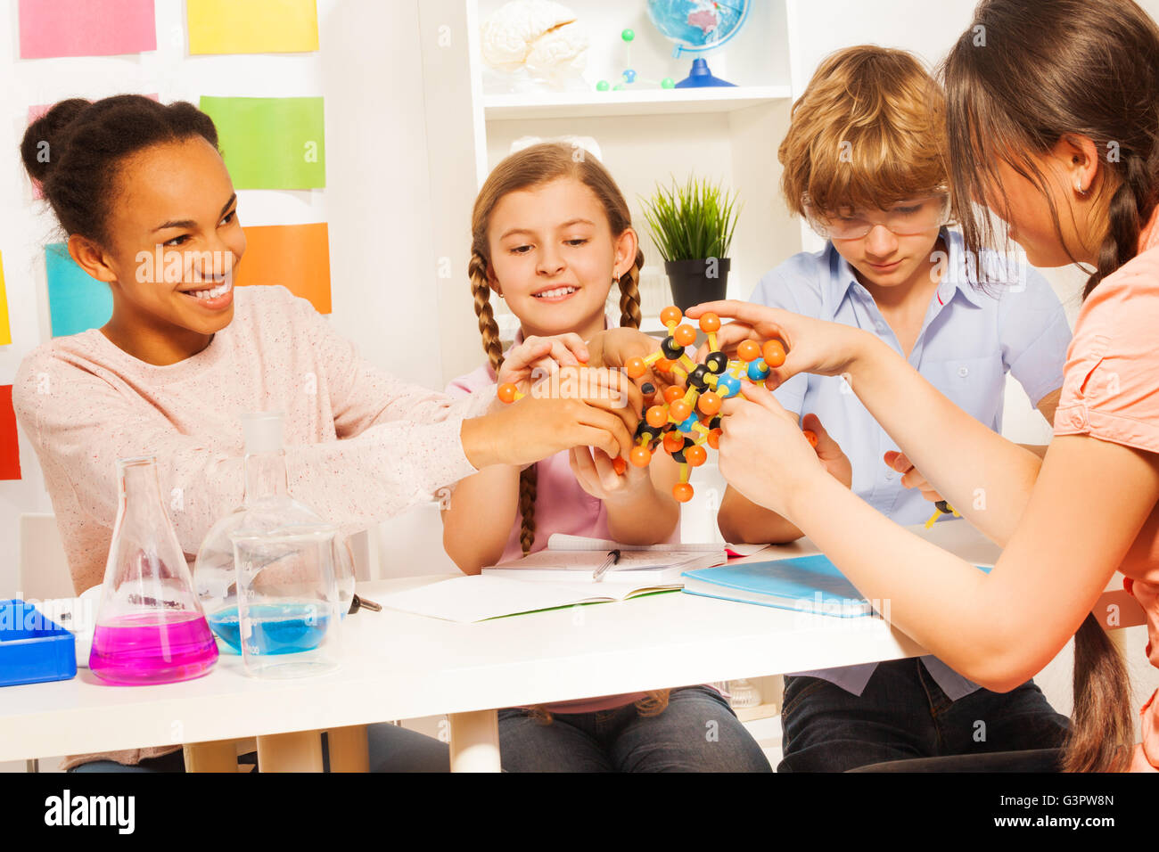 Kids assembling molecule model for science project Stock Photo - Alamy
