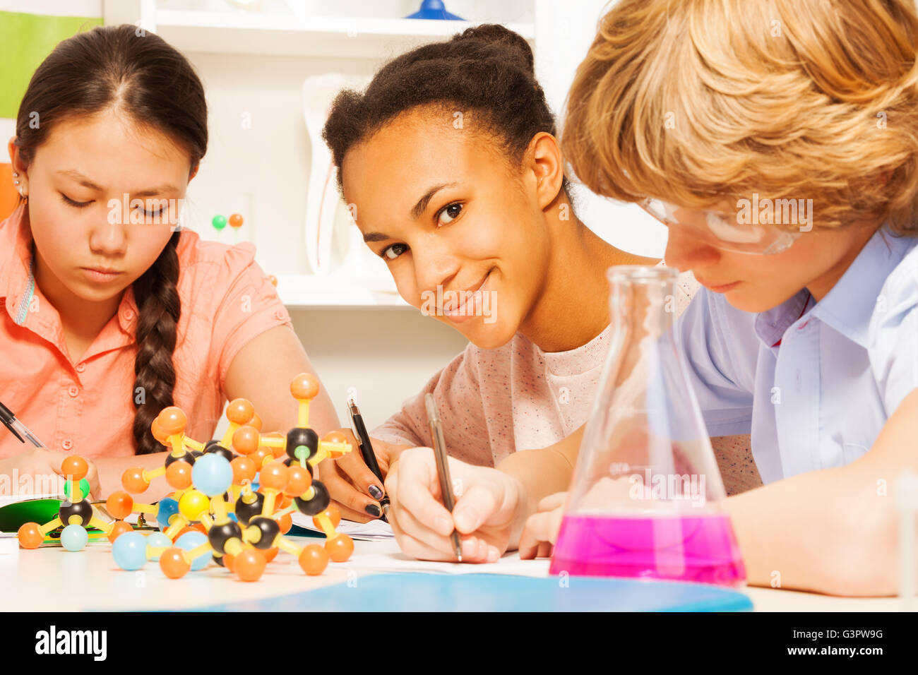Three Students Writing Chemical Formula At Class Stock Photo Alamy three-students-writing-chemical-formula-at-class-stock-photo-alamy