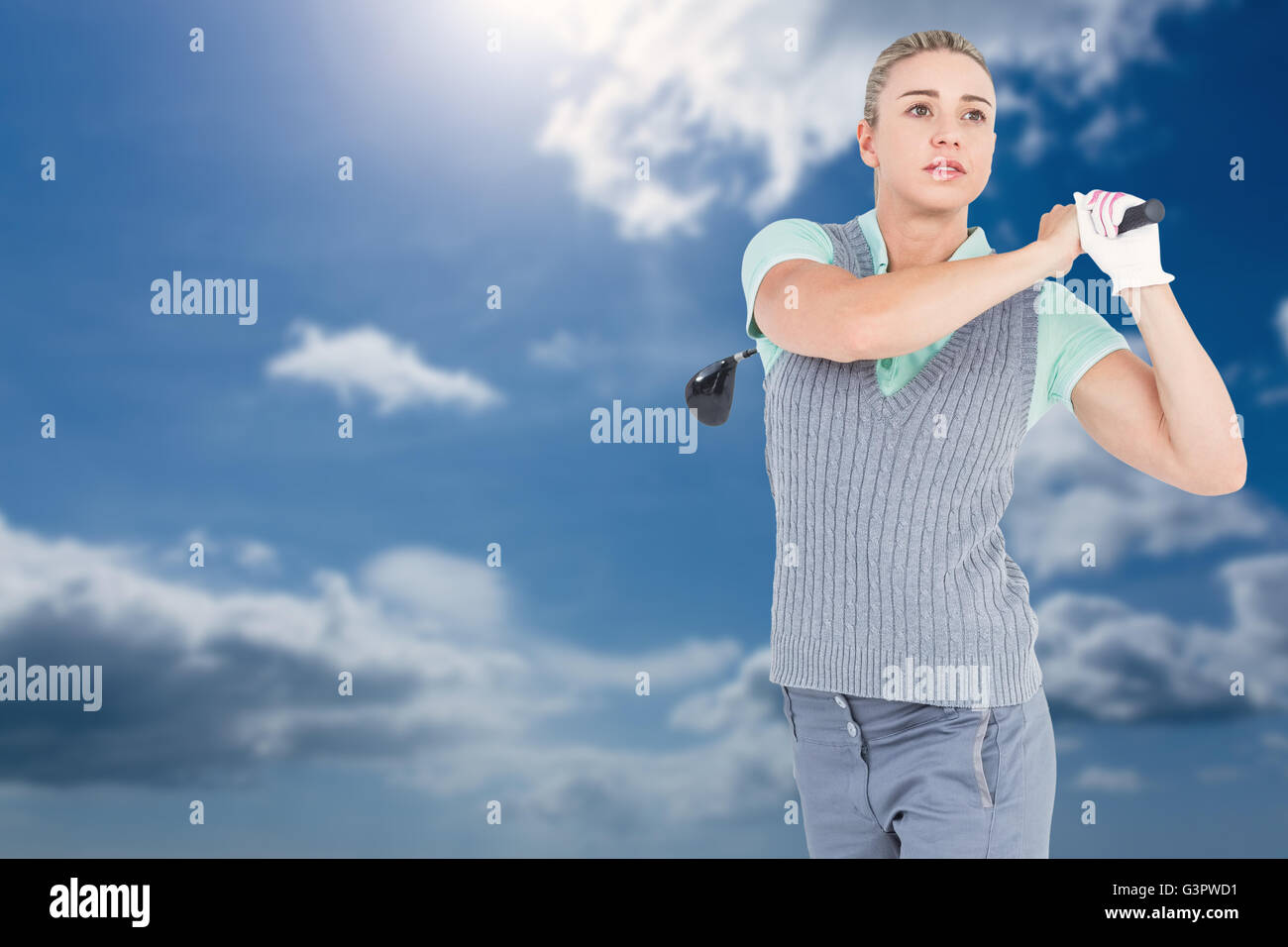 Pretty blonde playing golf Stock Photo - Alamy