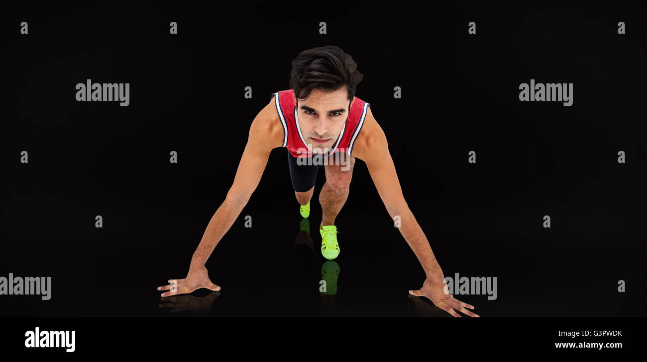 Composite image of male athlete in ready to run position Stock Photo ...