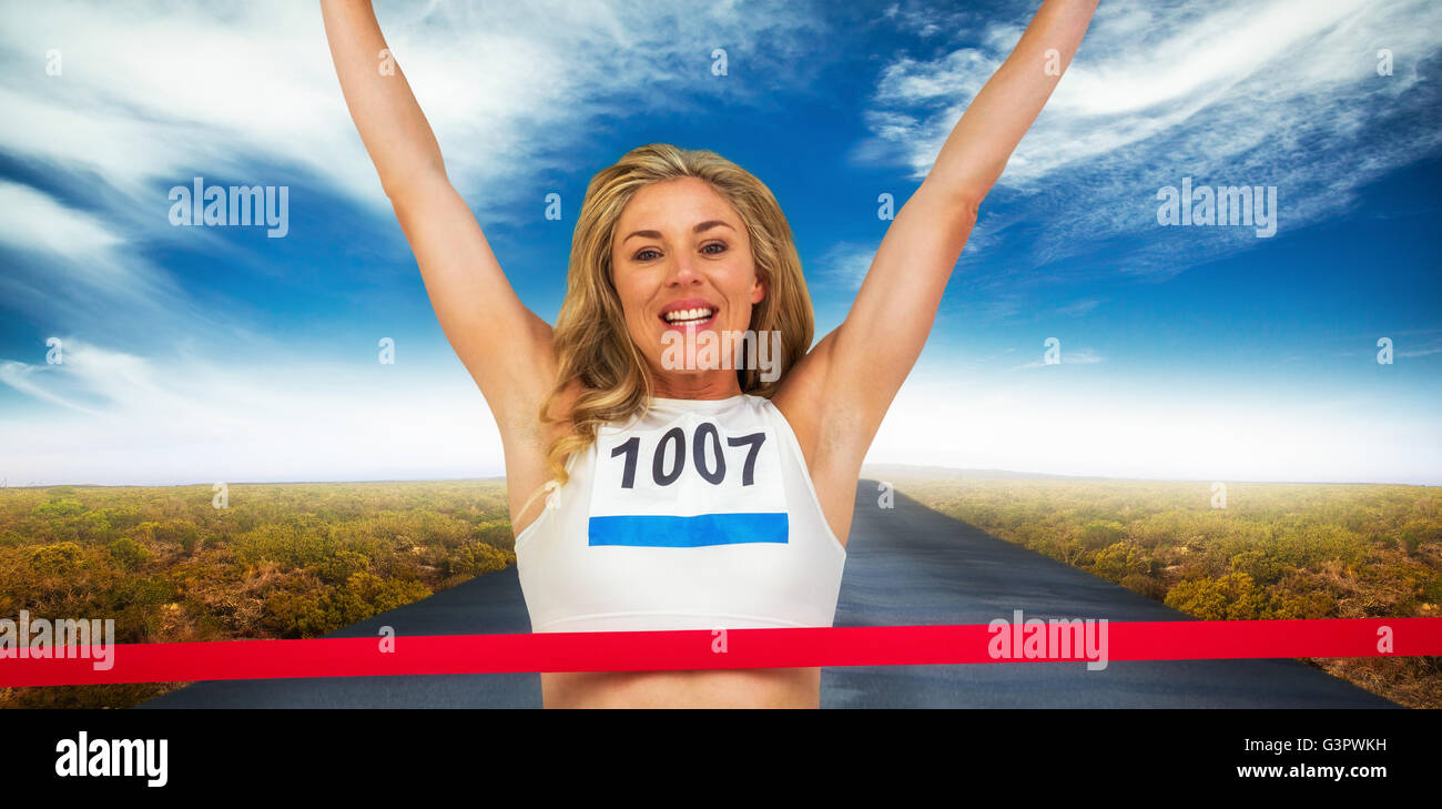 Female athlete crossing finish line hi-res stock photography and images ...