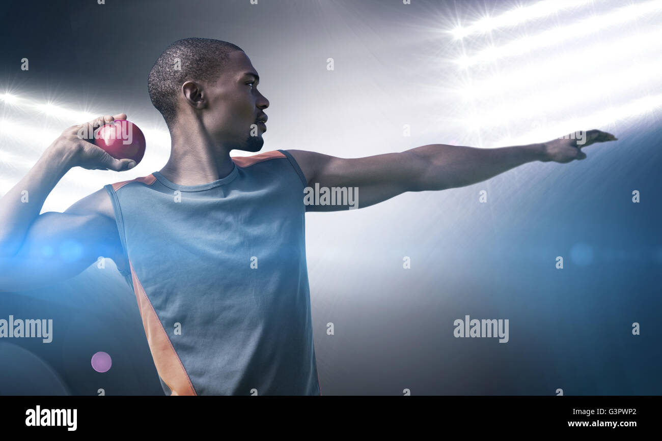 Profile view of sportsman practicing shot put Stock Photo - Alamy