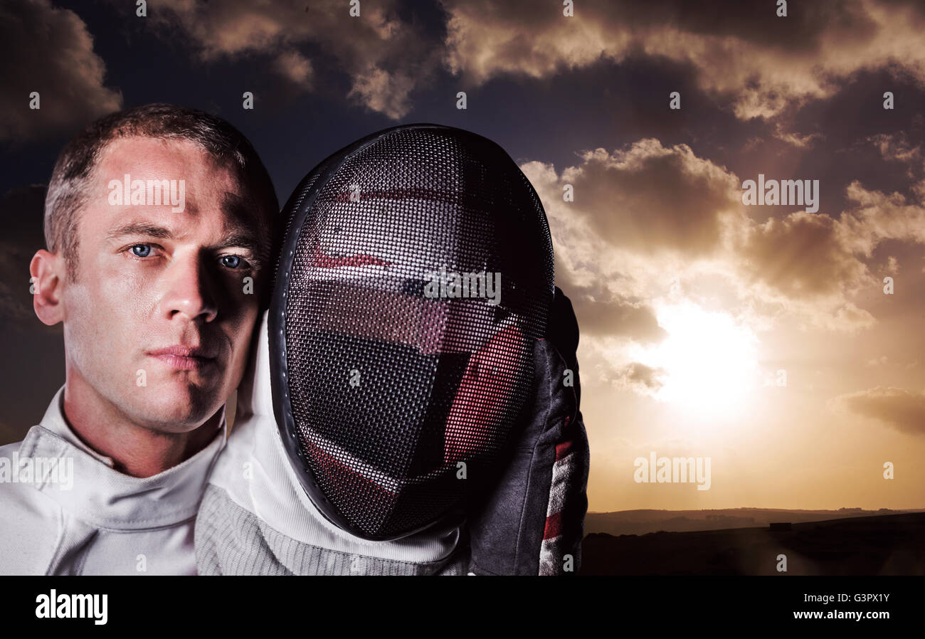 Composite image of close-up of swordsman holding fencing mask Stock ...