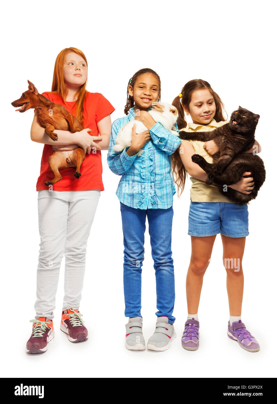 Three happy girls holding their beloved pets Stock Photo - Alamy