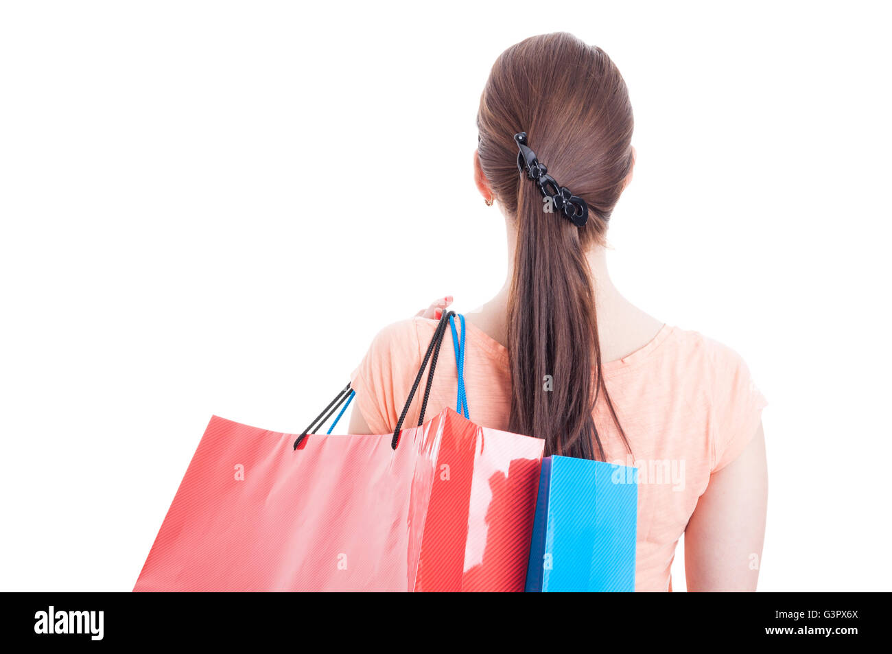 Back view of woman carrying shopping bags on shoulder isolated on white ...
