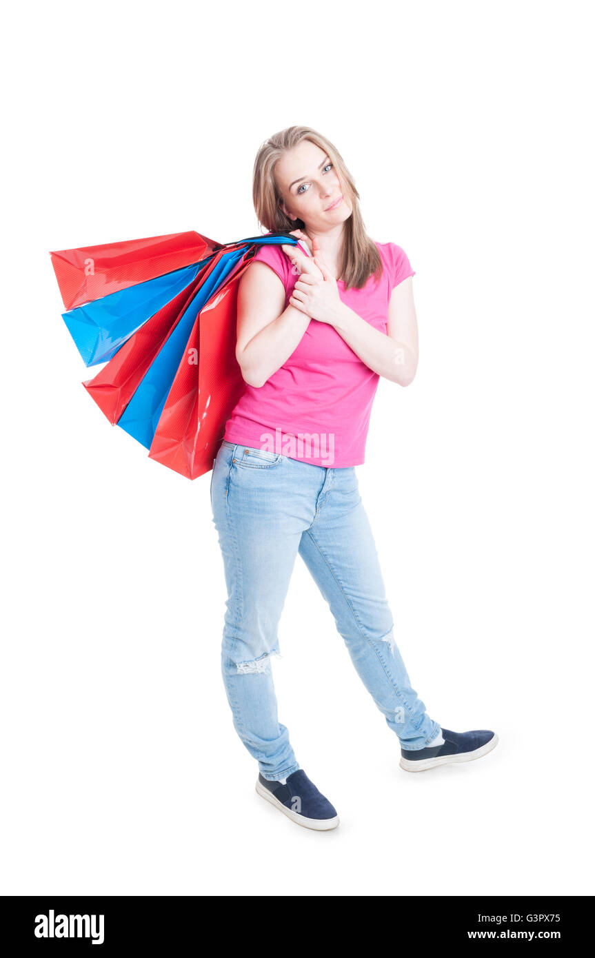 Beautiful young woman carrying paper bags in her back and doing ...