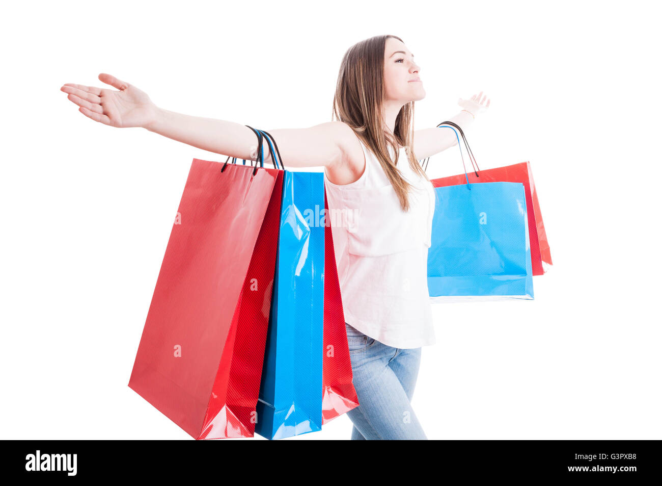 Freedom concept with beautiful shopaholic standing with arms wide open ...