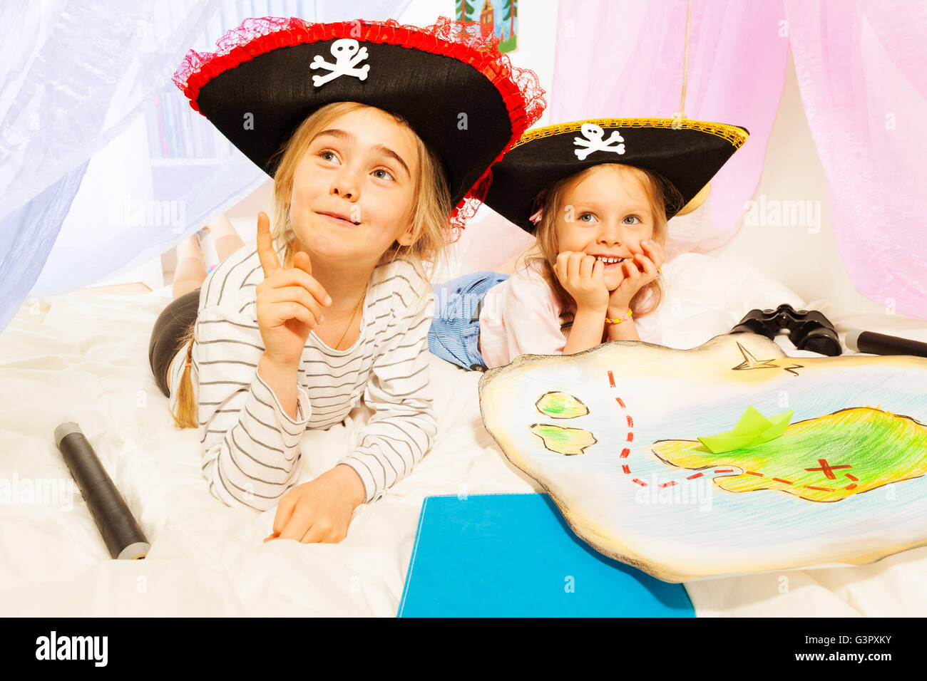 Two little girls playing pirates at imagine ship Stock Photo - Alamy