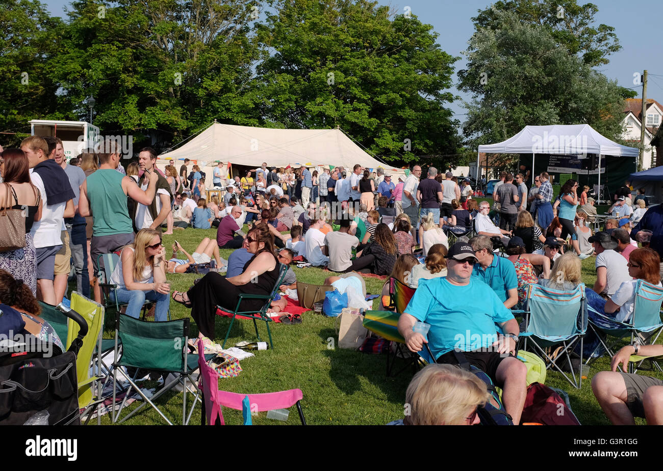 People at a traditional English summer party on the green or fete in ...
