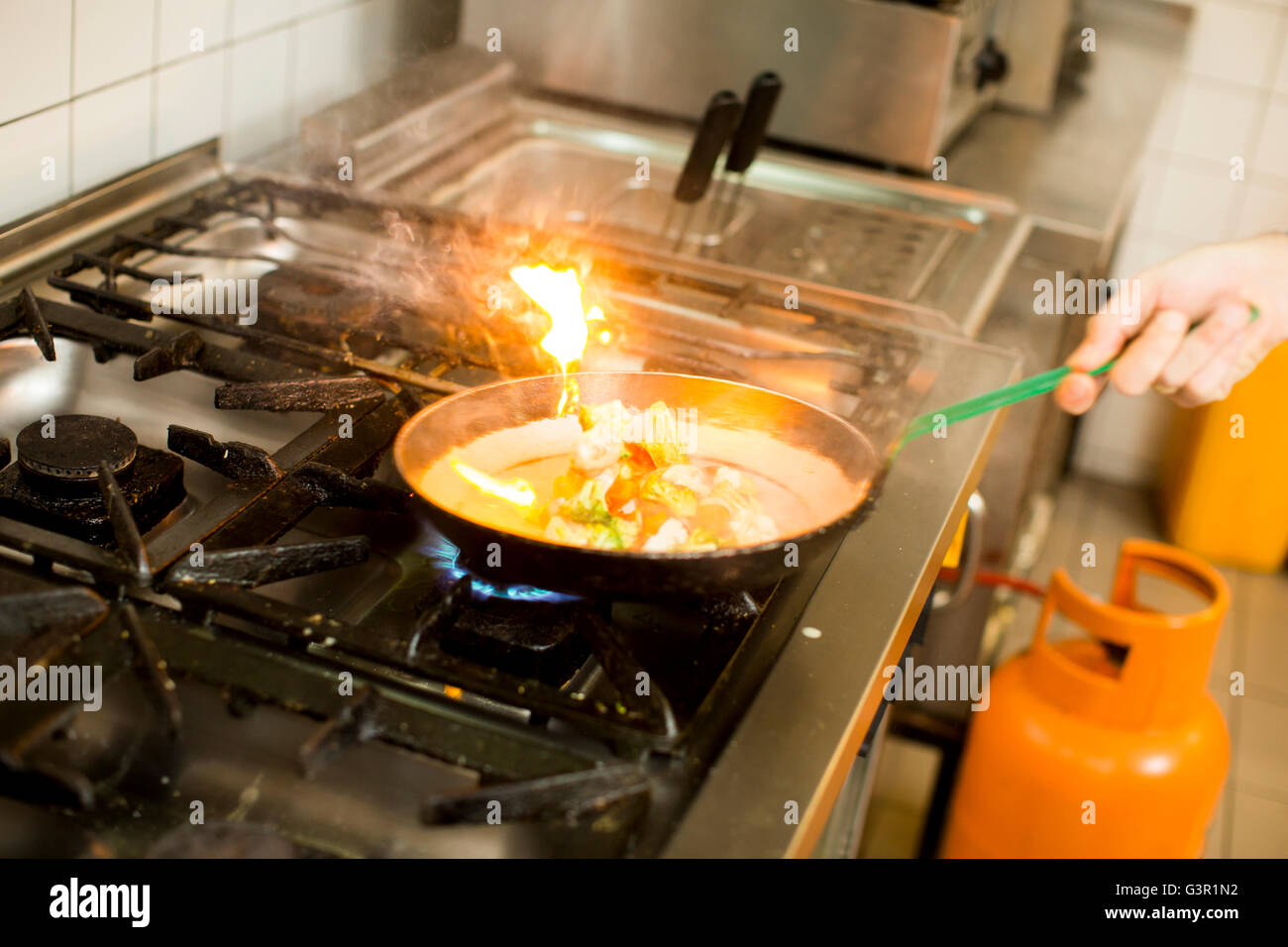 Flaming stir fry wok dish hi-res stock photography and images - Alamy