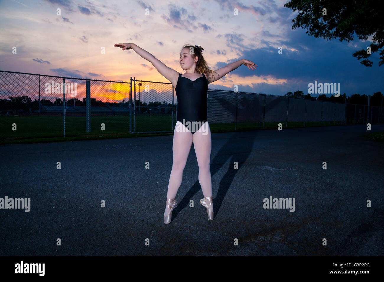 Young Tween Caucasian Girl practices Ballet in her Backyard Stock Photo ...