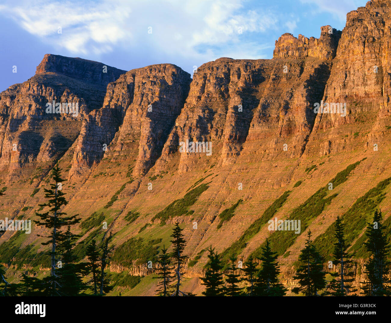 USA, Montana, Glacier National Park, Sunset light warms peaks of the ...